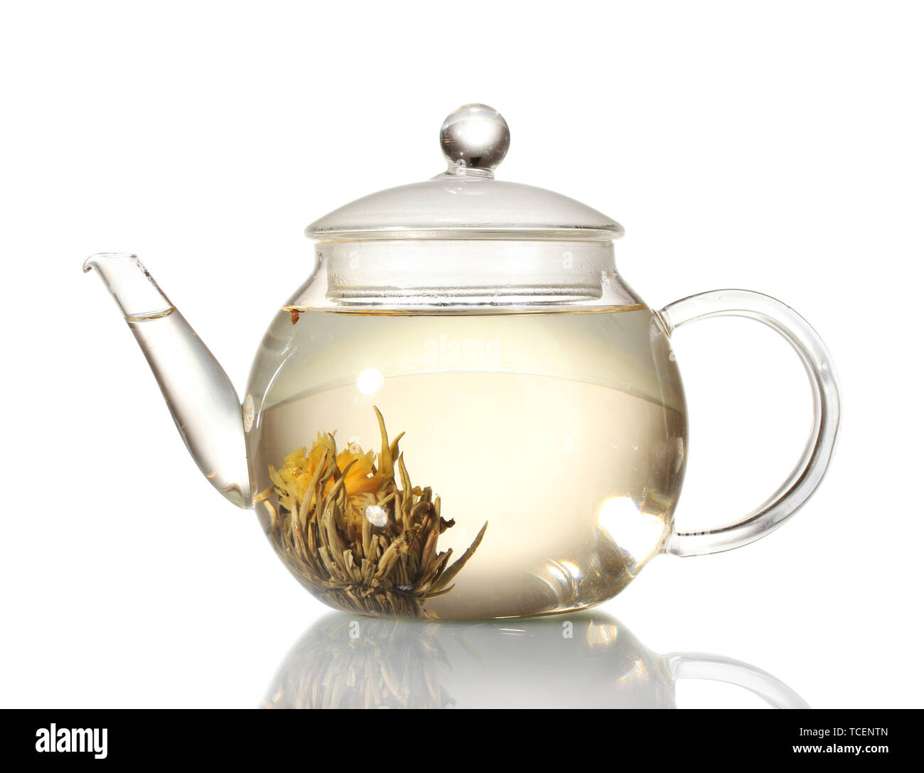 exotic green tea with flowers in glass teapot isolated on white Stock ...