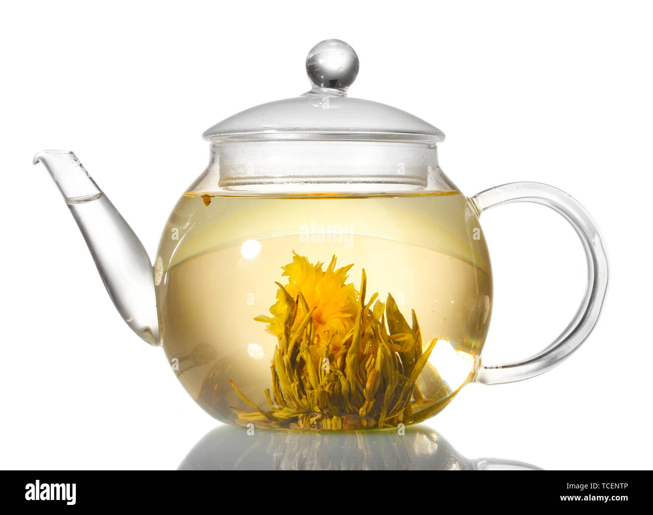 exotic green tea with flowers in glass teapot isolated on white Stock ...