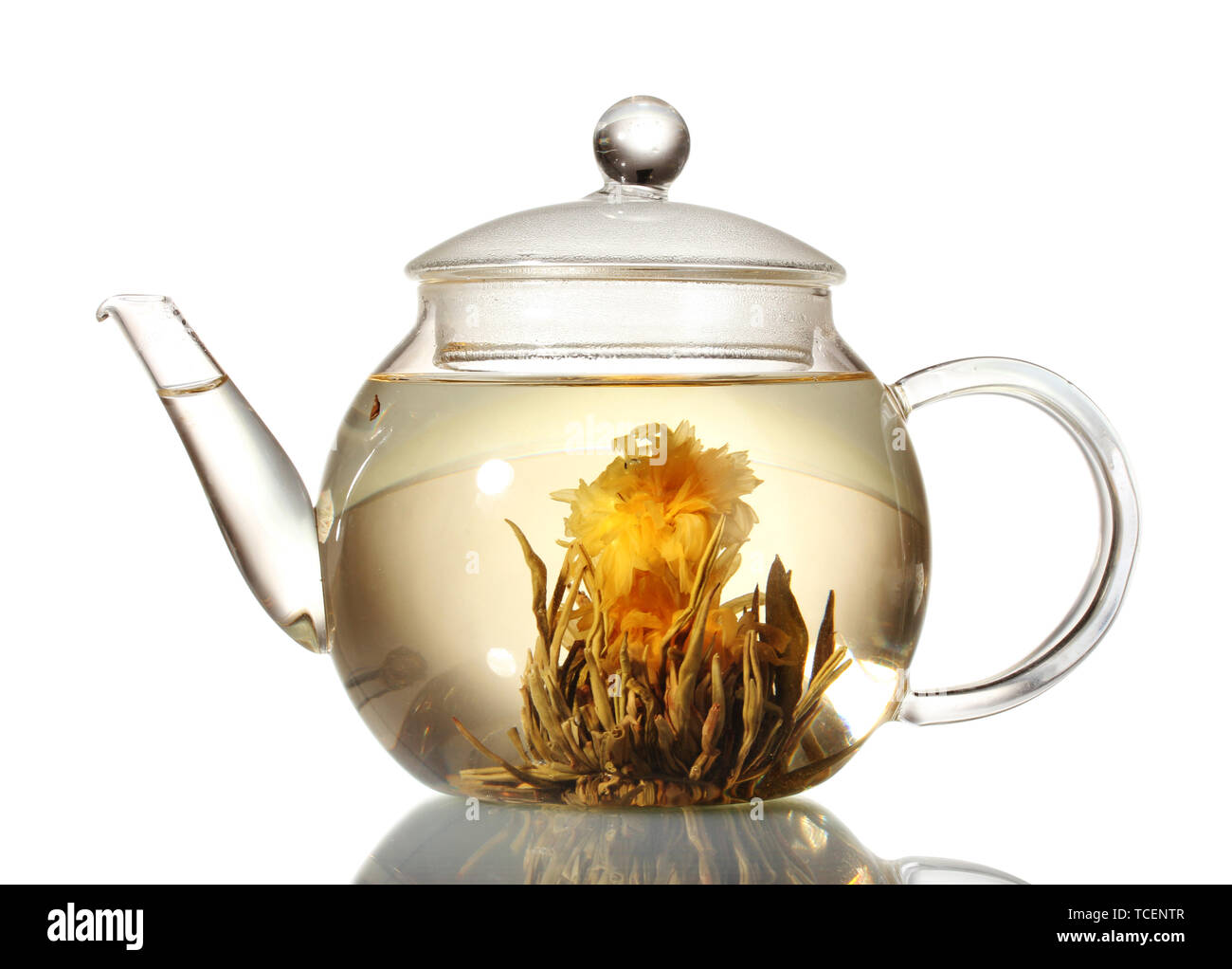 exotic green tea with flowers in glass teapot isolated on white Stock ...