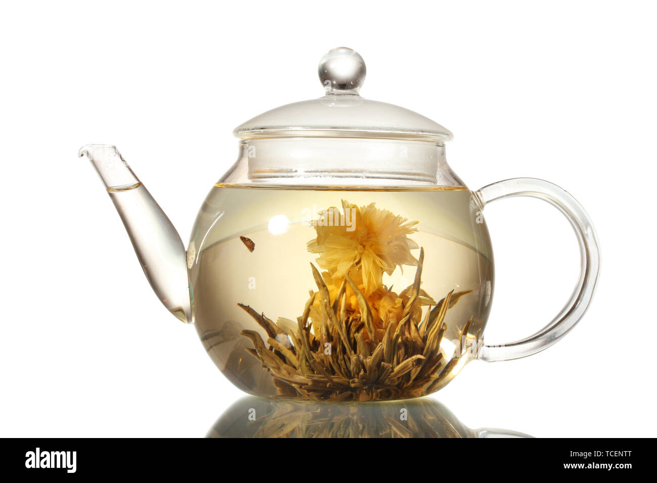 exotic green tea with flowers in glass teapot isolated on white Stock ...