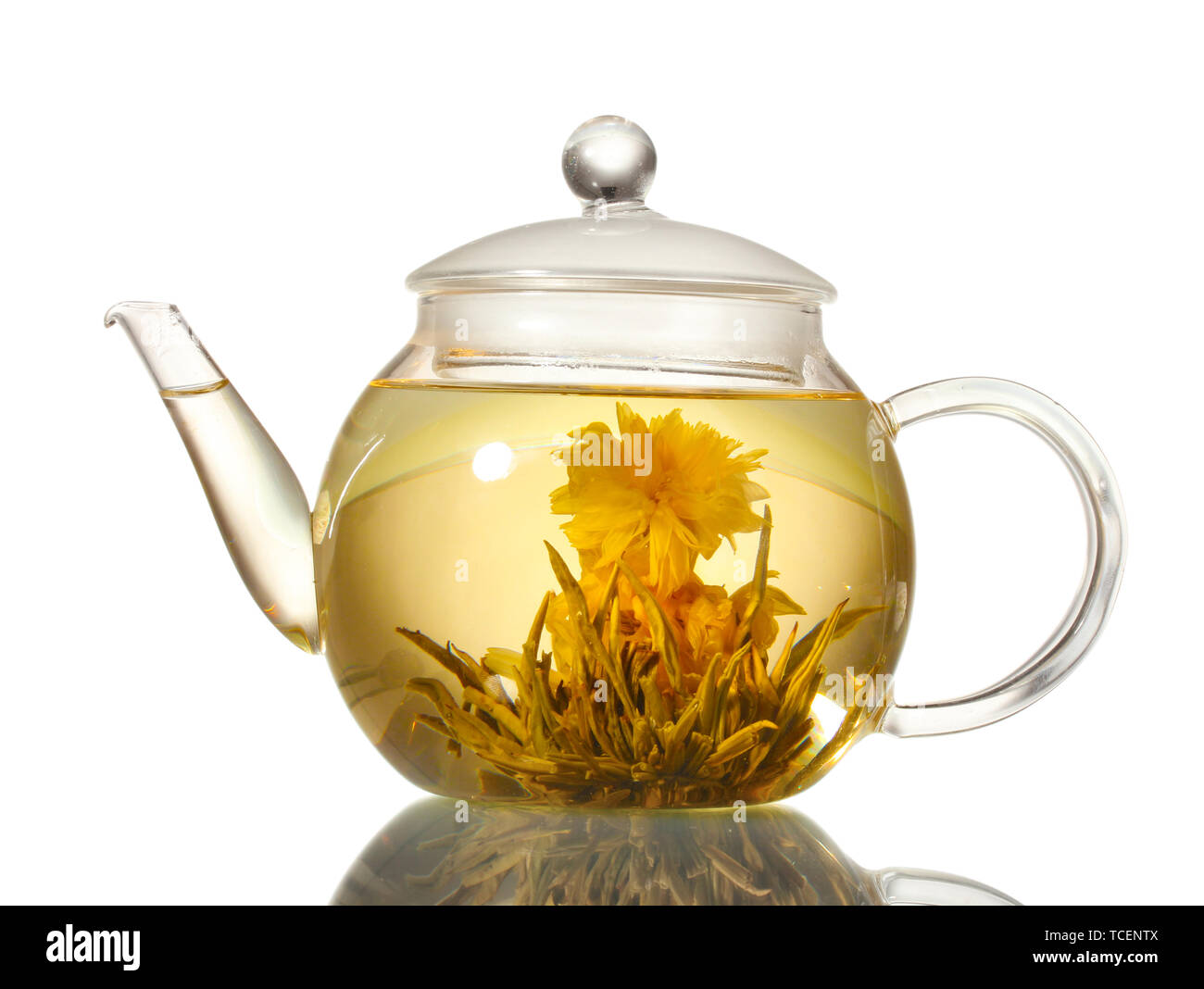 exotic green tea with flowers in glass teapot isolated on white Stock ...