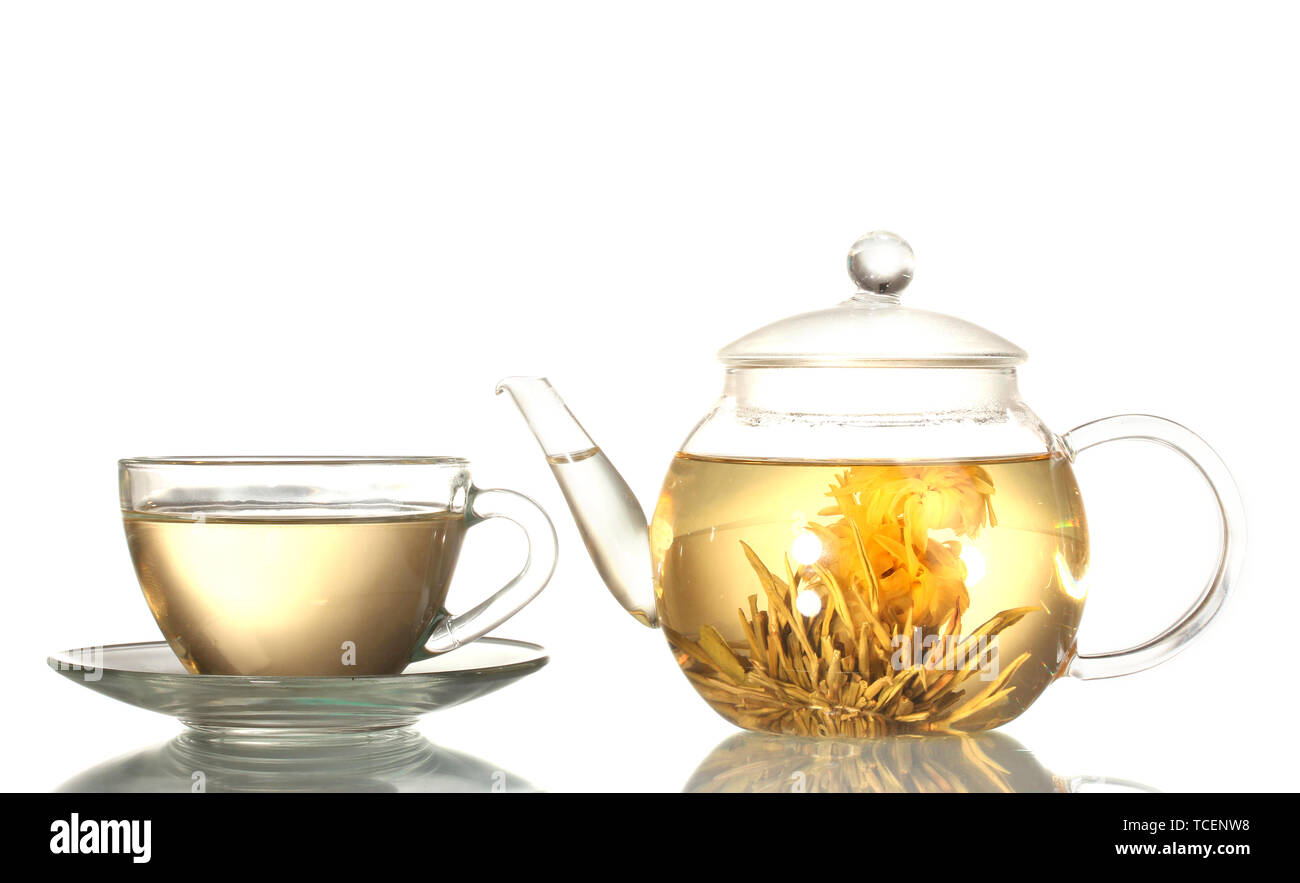 exotic green tea with flowers in glass teapot and cup isolated on white ...