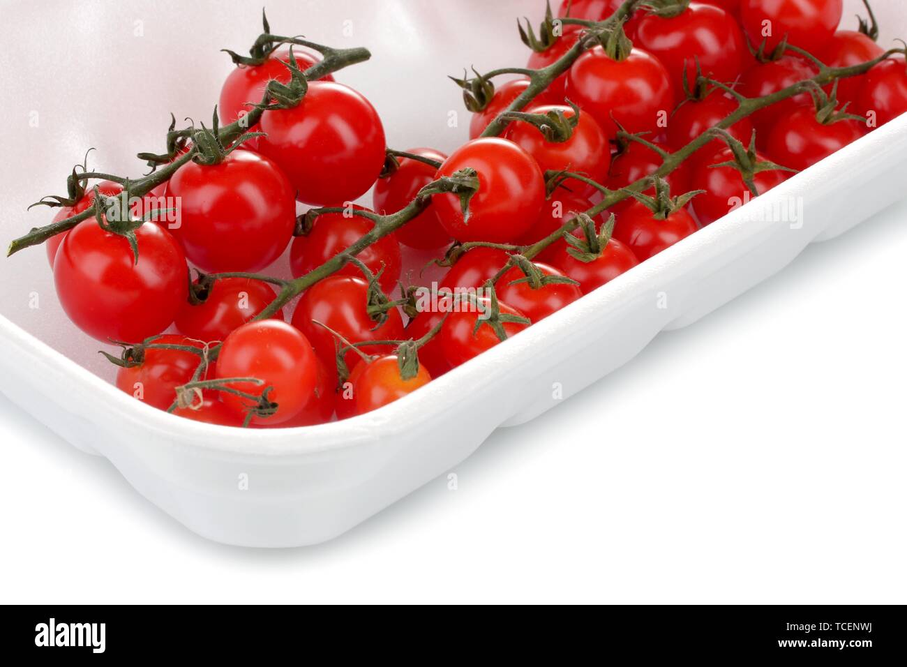 cherry tomatoes in packaging isolated on white Stock Photo - Alamy