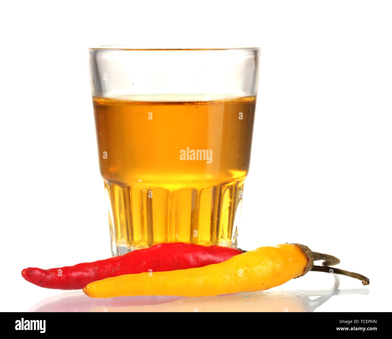 glass of pepper vodka and red chili peppers isolated on white Stock ...