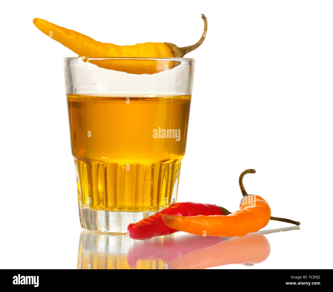glass of pepper vodka and red chili peppers isolated on white Stock ...