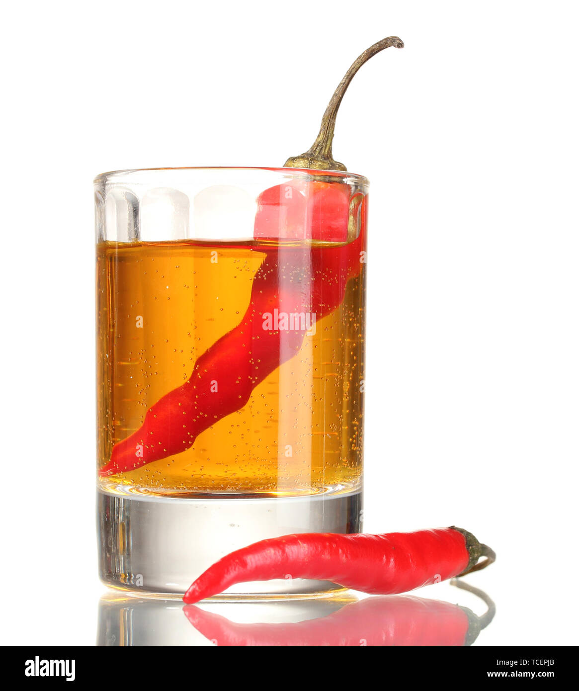 glass of pepper vodka and red chili peppers isolated on white Stock ...