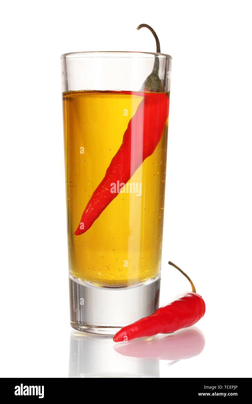 glass of pepper vodka and red chili peppers isolated on white Stock ...