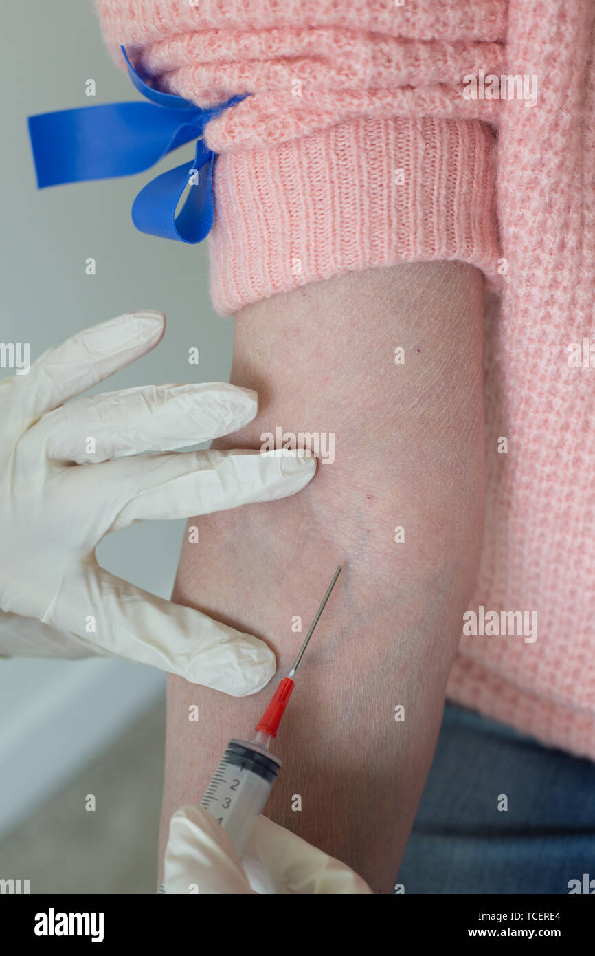 Doctor applying vaccine injection closeup retired female Stock Photo ...
