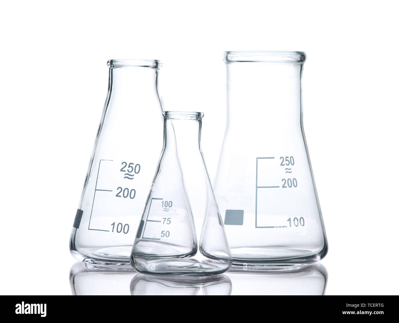 Three empty flasks with reflection isolated on white Stock Photo - Alamy