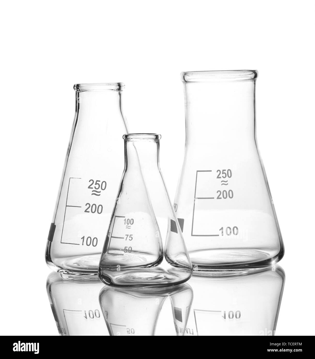 Three empty flasks with reflection isolated on white Stock Photo - Alamy