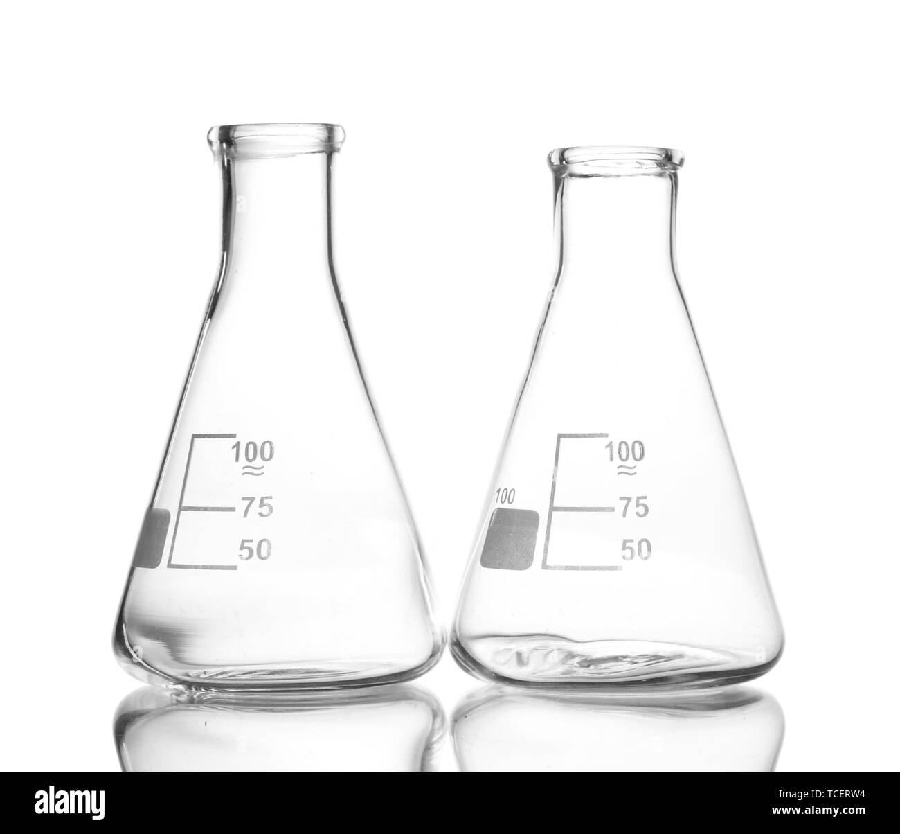 Two empty flasks with reflection isolated on white Stock Photo - Alamy