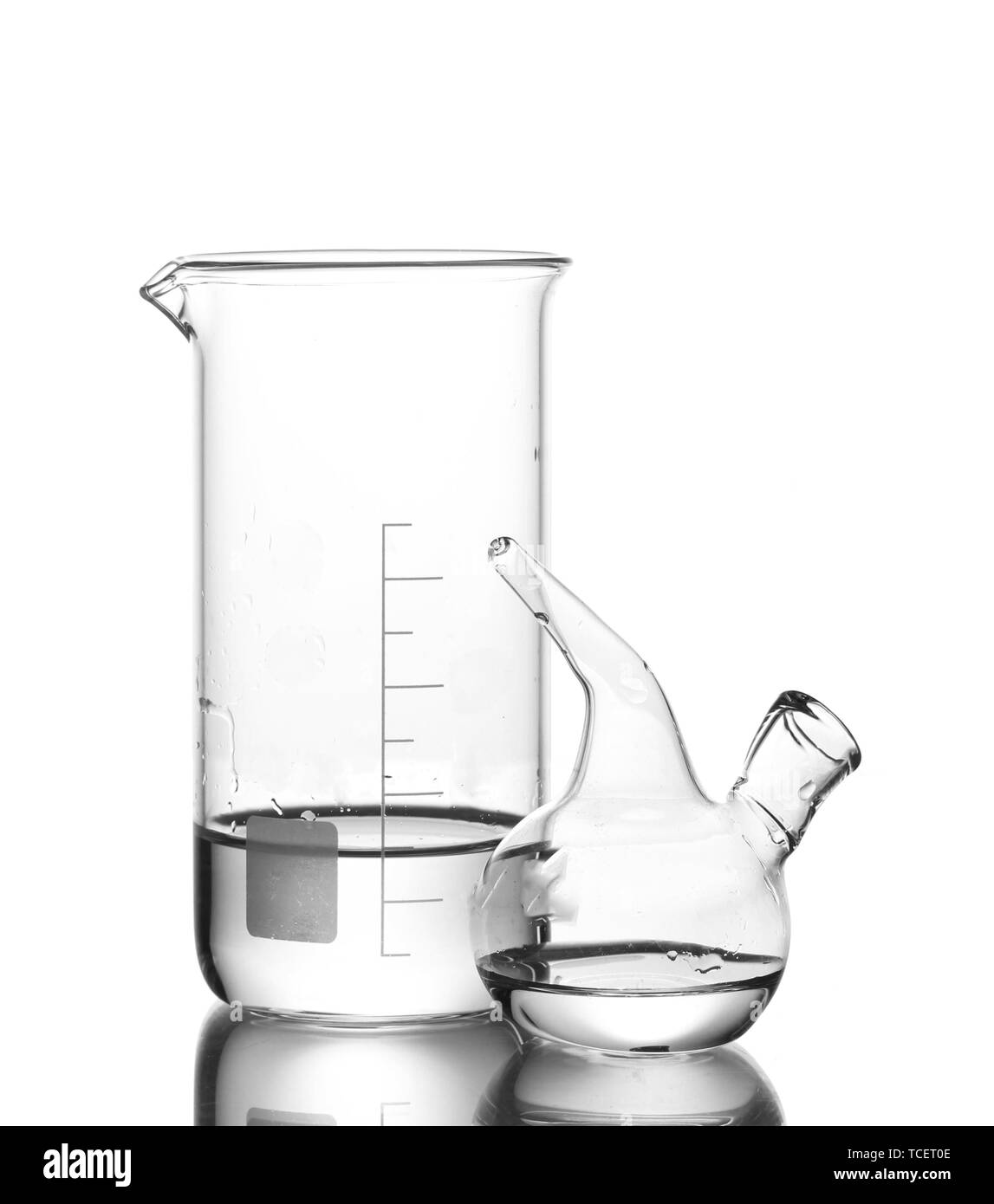 Measuring beaker and Schuster's dropper with water and reflection ...