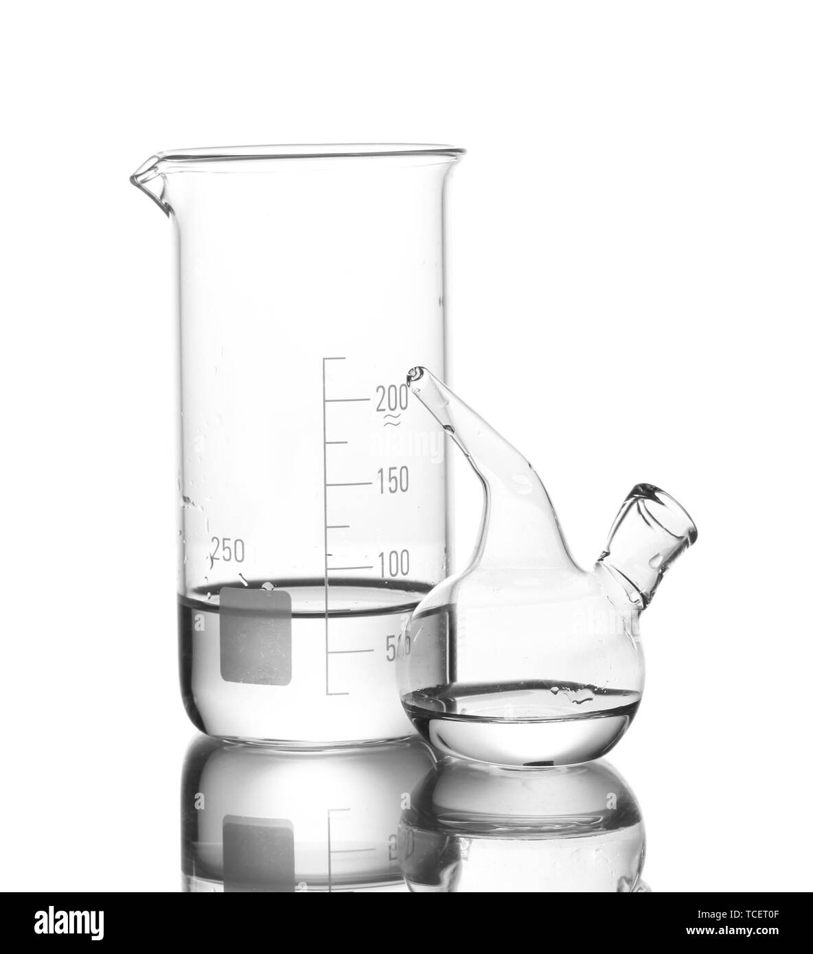 Measuring beaker and Schuster's dropper with water and reflection ...