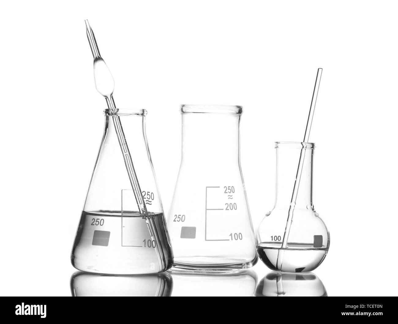 Two flasks with water and one empty flask with reflection isolated on ...