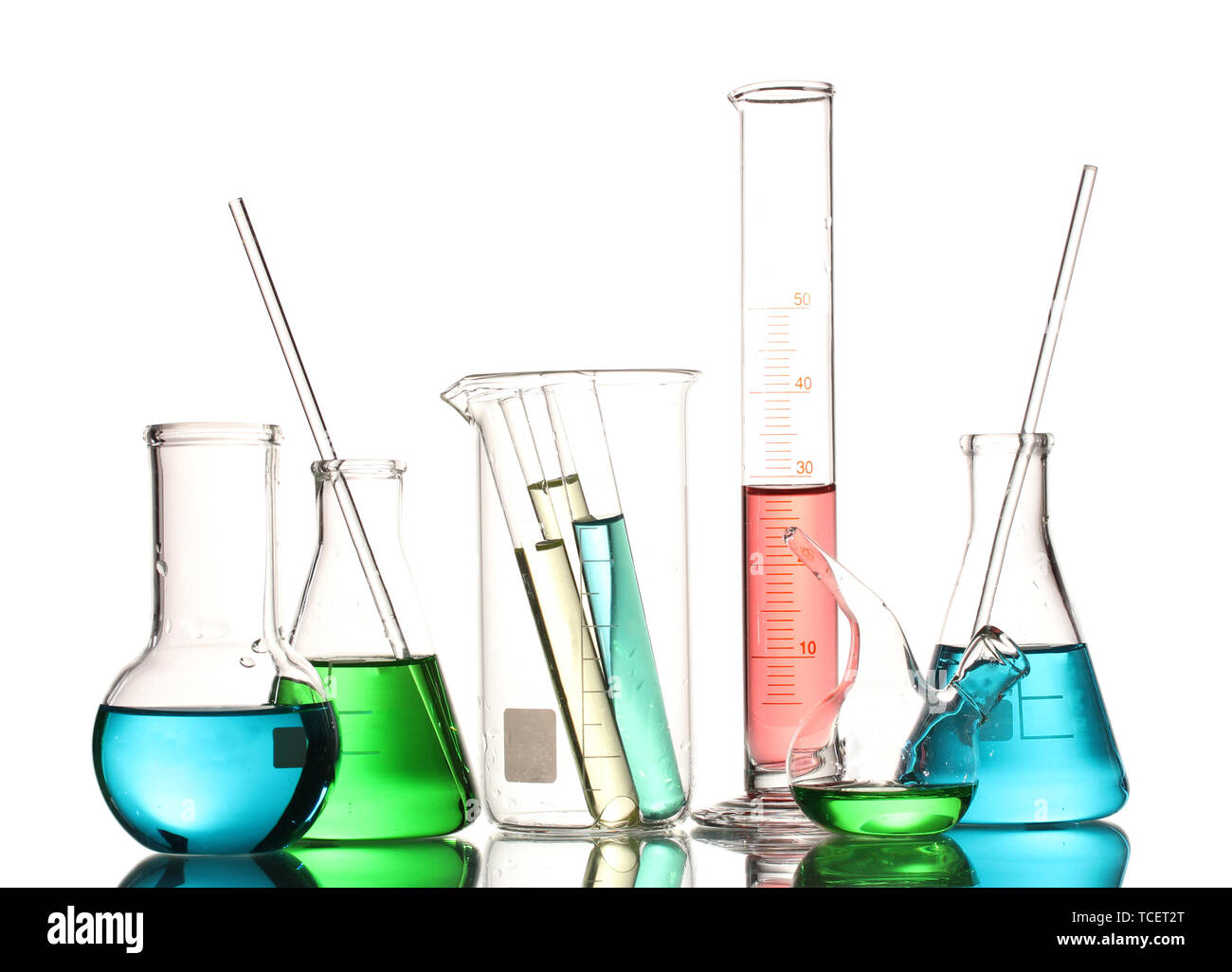 Different laboratory glassware with color liquid and with reflection ...