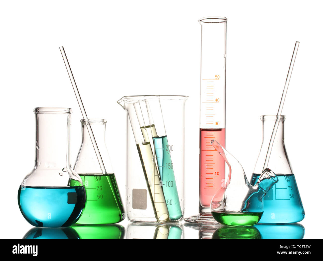 Different laboratory glassware with color liquid and with reflection ...