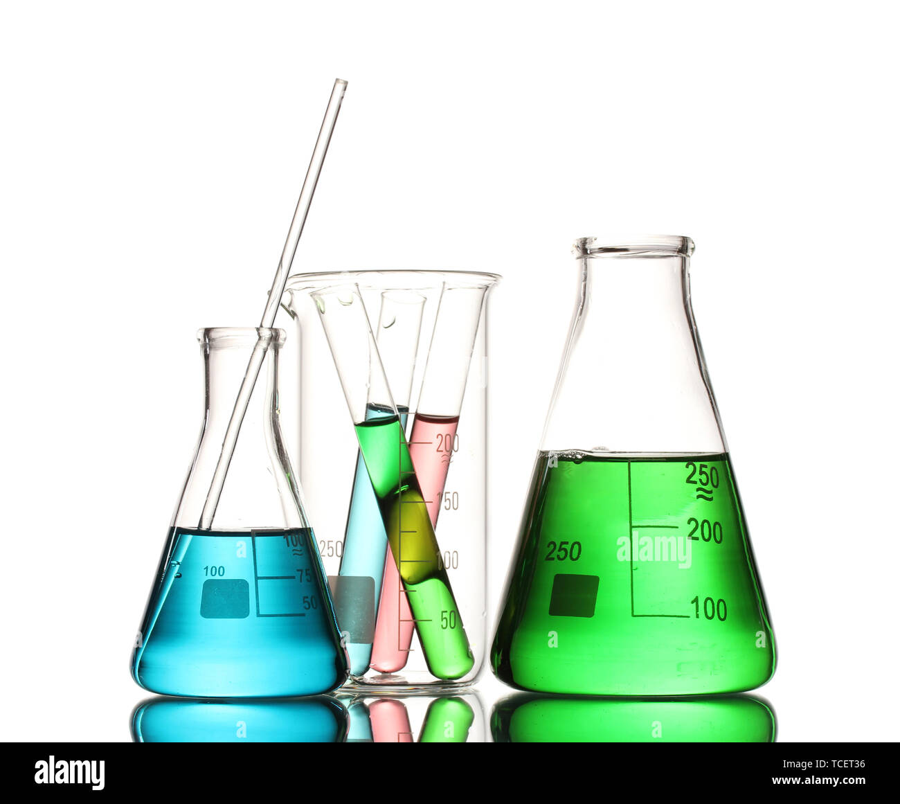 Different laboratory glassware with color liquid and with reflection ...