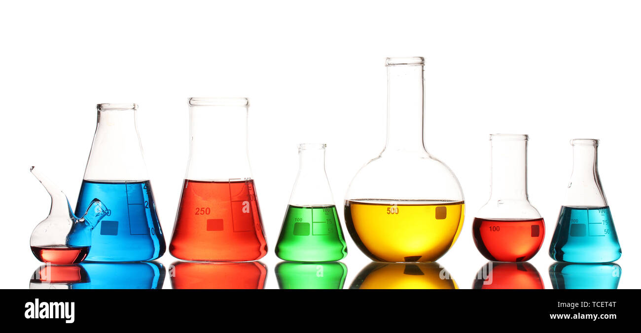 Different laboratory glassware with color liquid and with reflection ...