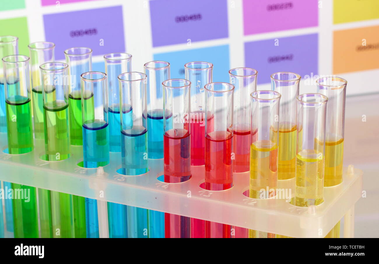 Test-tubes with color liquid on color samples background Stock Photo ...