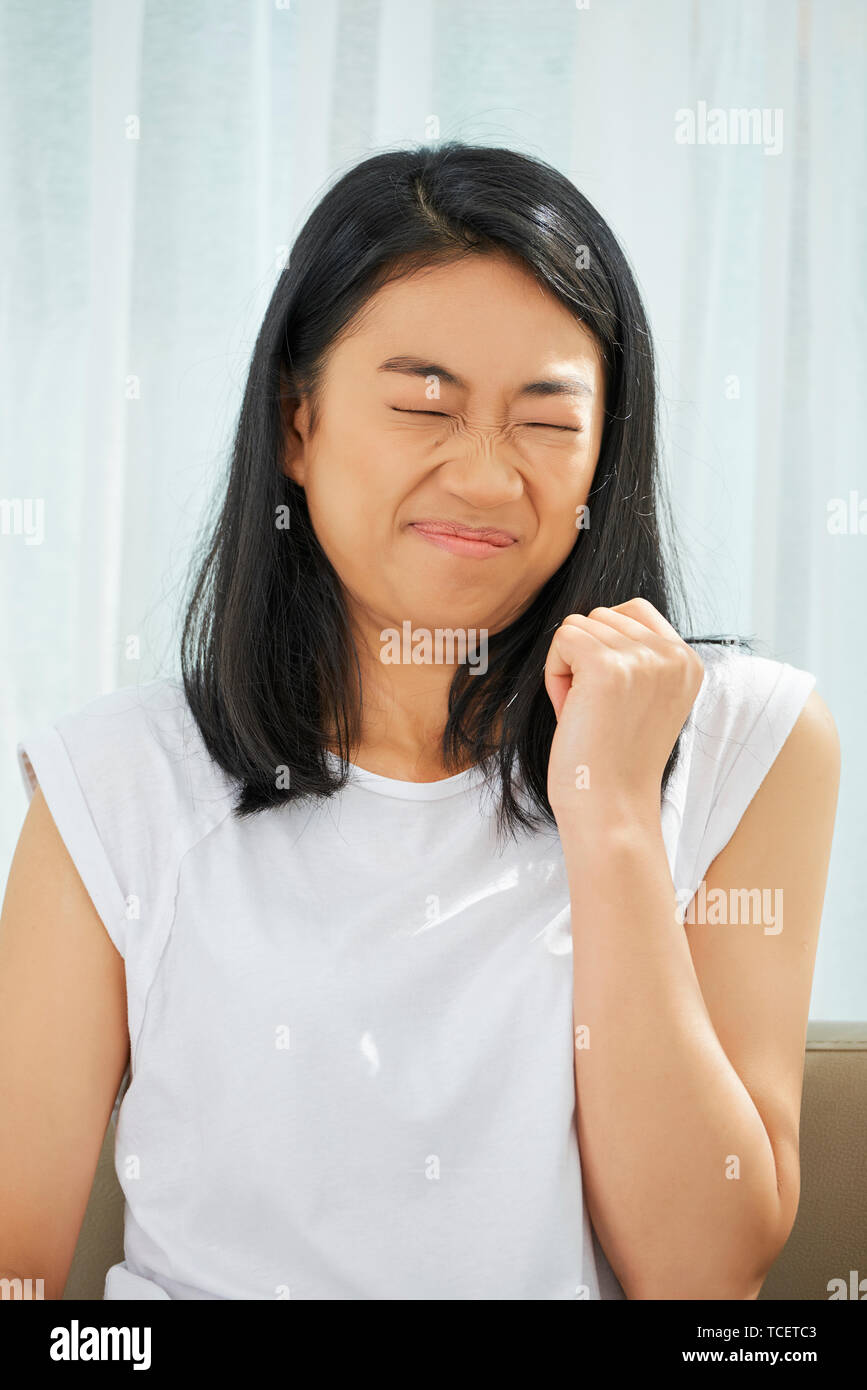 Portrait of pretty Asian teenage girl frowning with disgust Stock Photo ...
