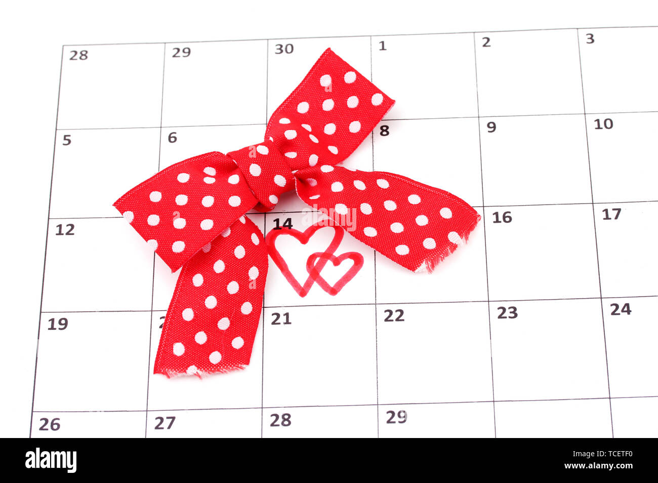 Calendar page with hearts and bow on St.Valentines Day Stock Photo - Alamy