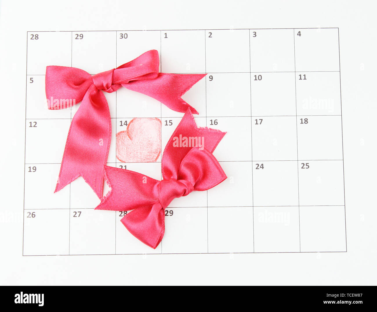 Calendar page with hearts and bows on St.Valentines Day Stock Photo - Alamy