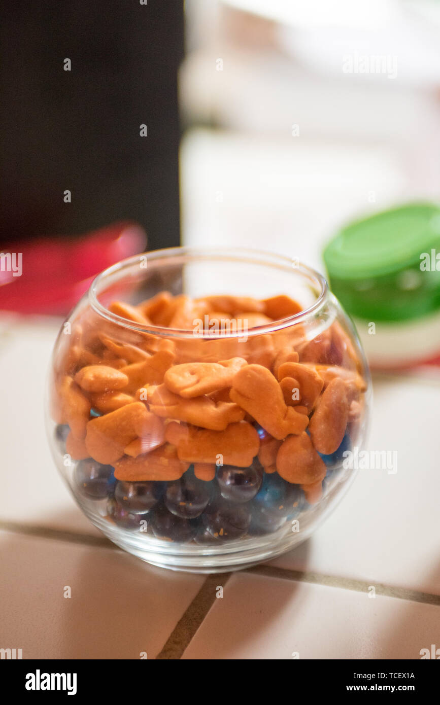 orange cheese crackers in fish bowl Stock Photo - Alamy