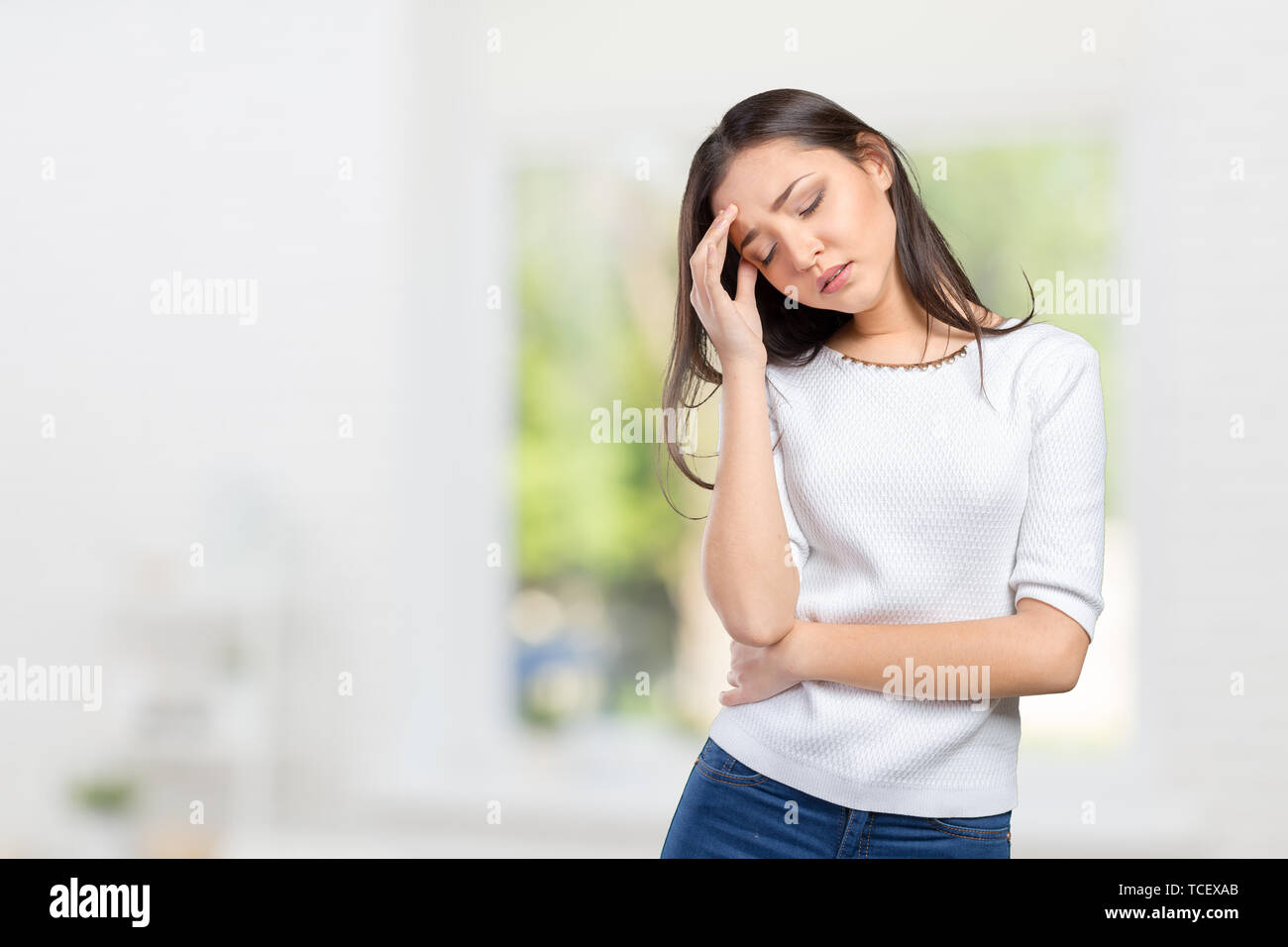 Portrait stressed sad young woman standing Stock Photo - Alamy