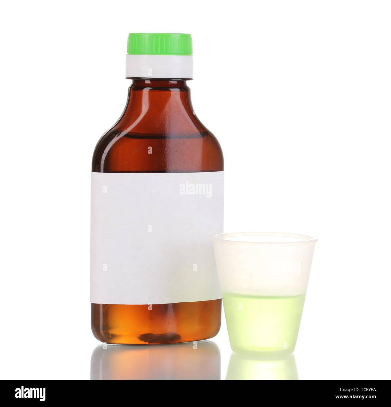 Medical bottle and jigger isolated on white Stock Photo - Alamy