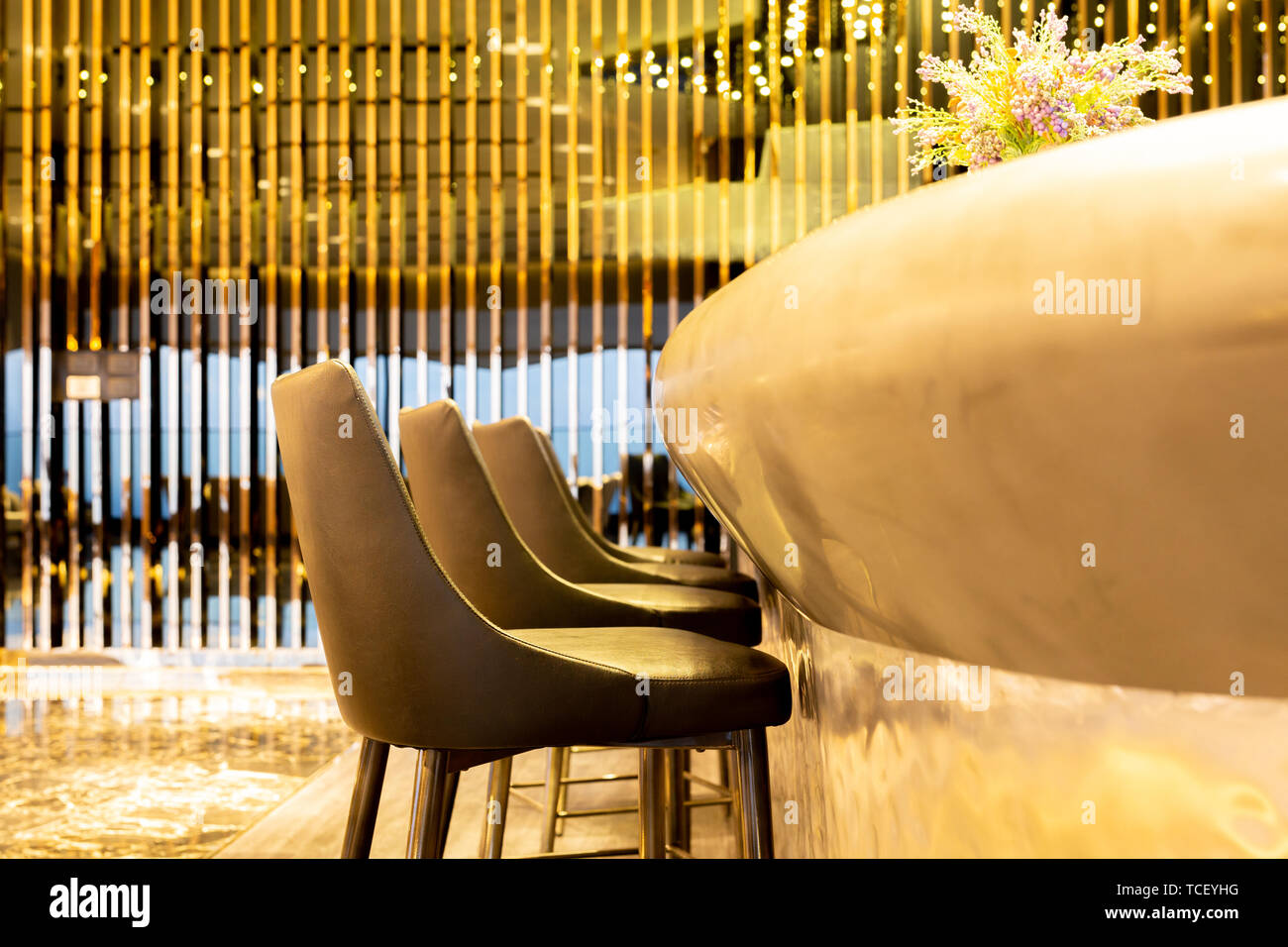 Interior design row of modern leather stools chair in luxury lounge ...