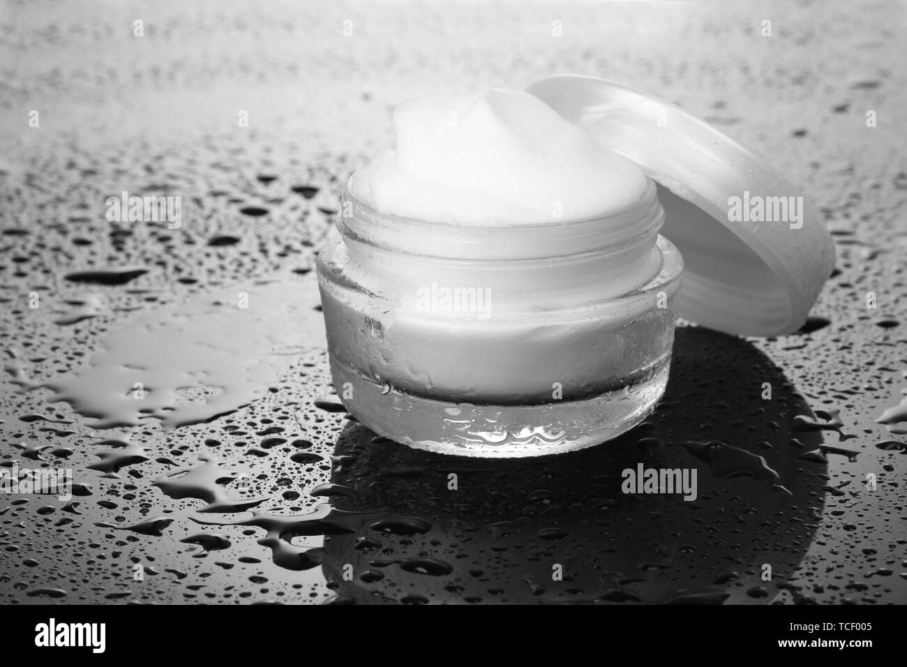 cosmetic cream on table on grey background Stock Photo - Alamy