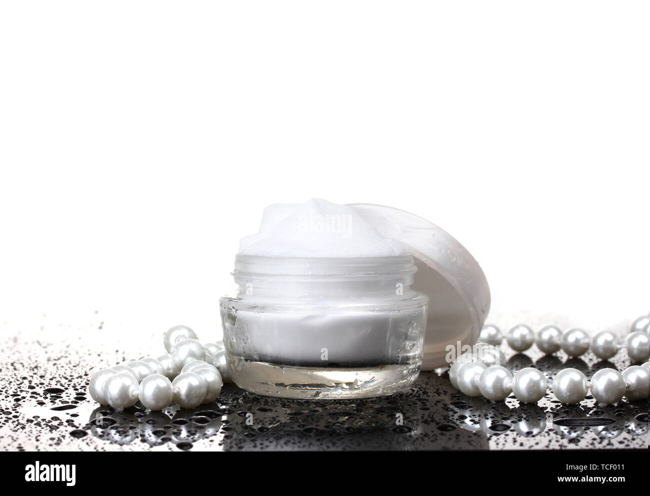 cosmetic cream on table isolated on white Stock Photo - Alamy