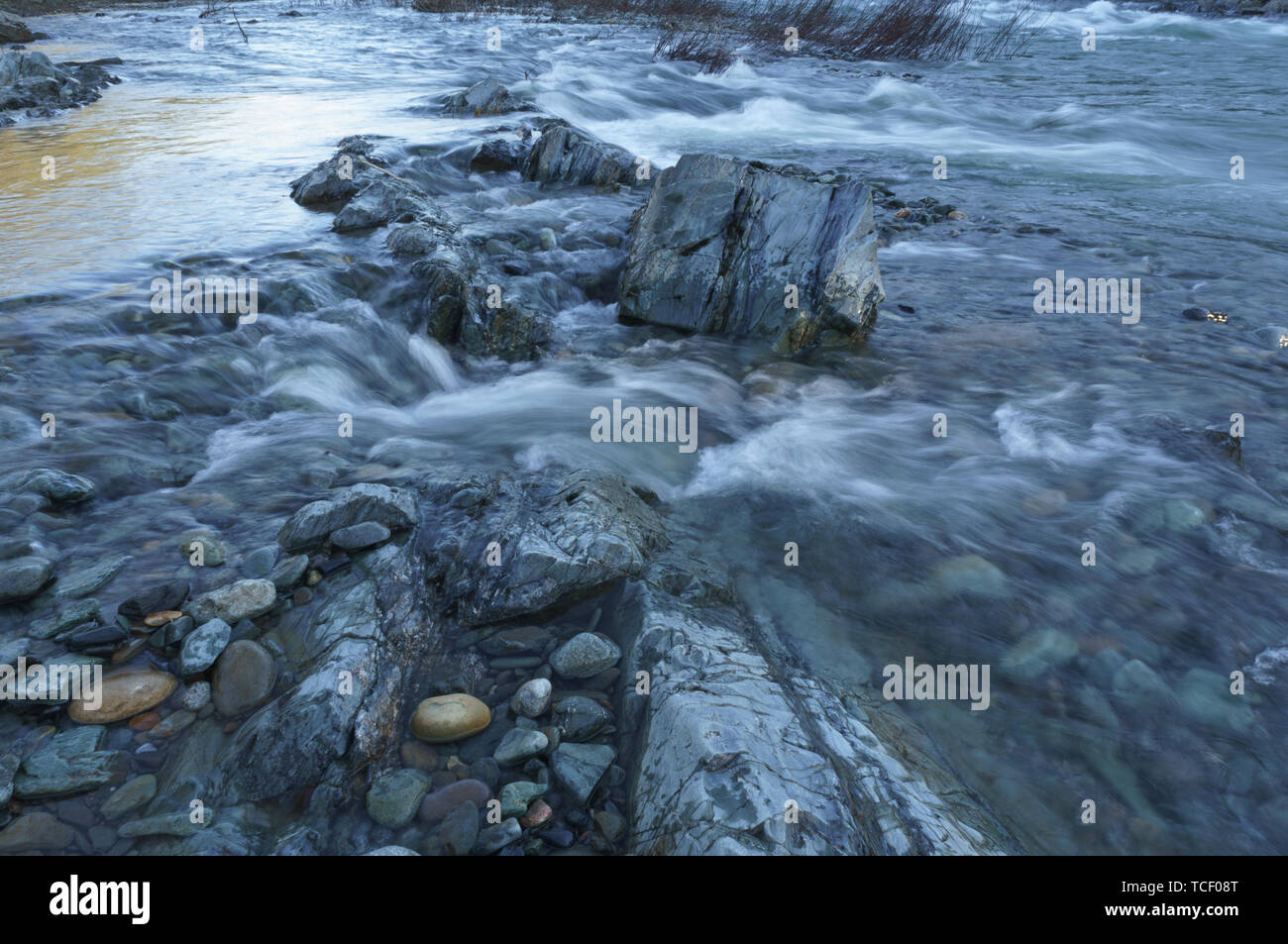 Rapid water flowing river with harsh rocks Stock Photo - Alamy