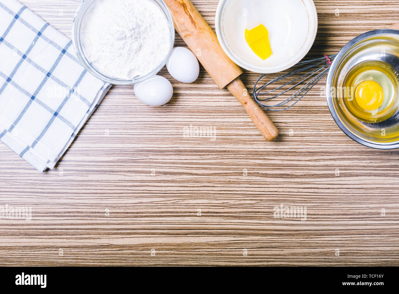 Wooden background with baking ingredients. Top view Stock Photo - Alamy