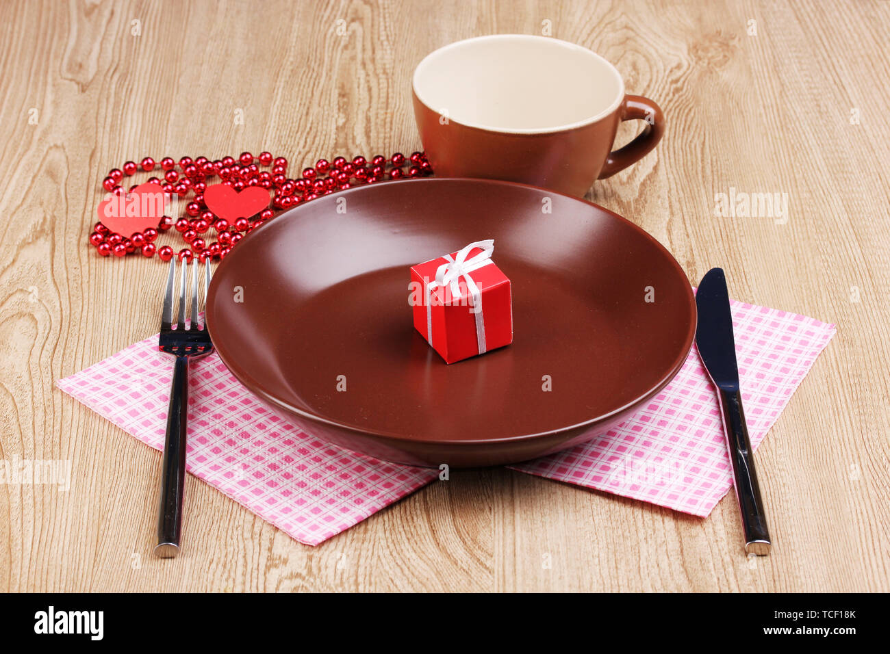 Table setting on wooden background Stock Photo - Alamy