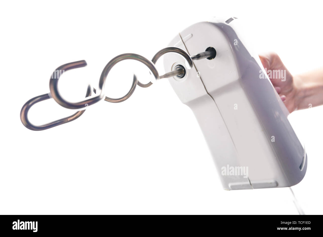 Hand holding a mixer Stock Photo - Alamy
