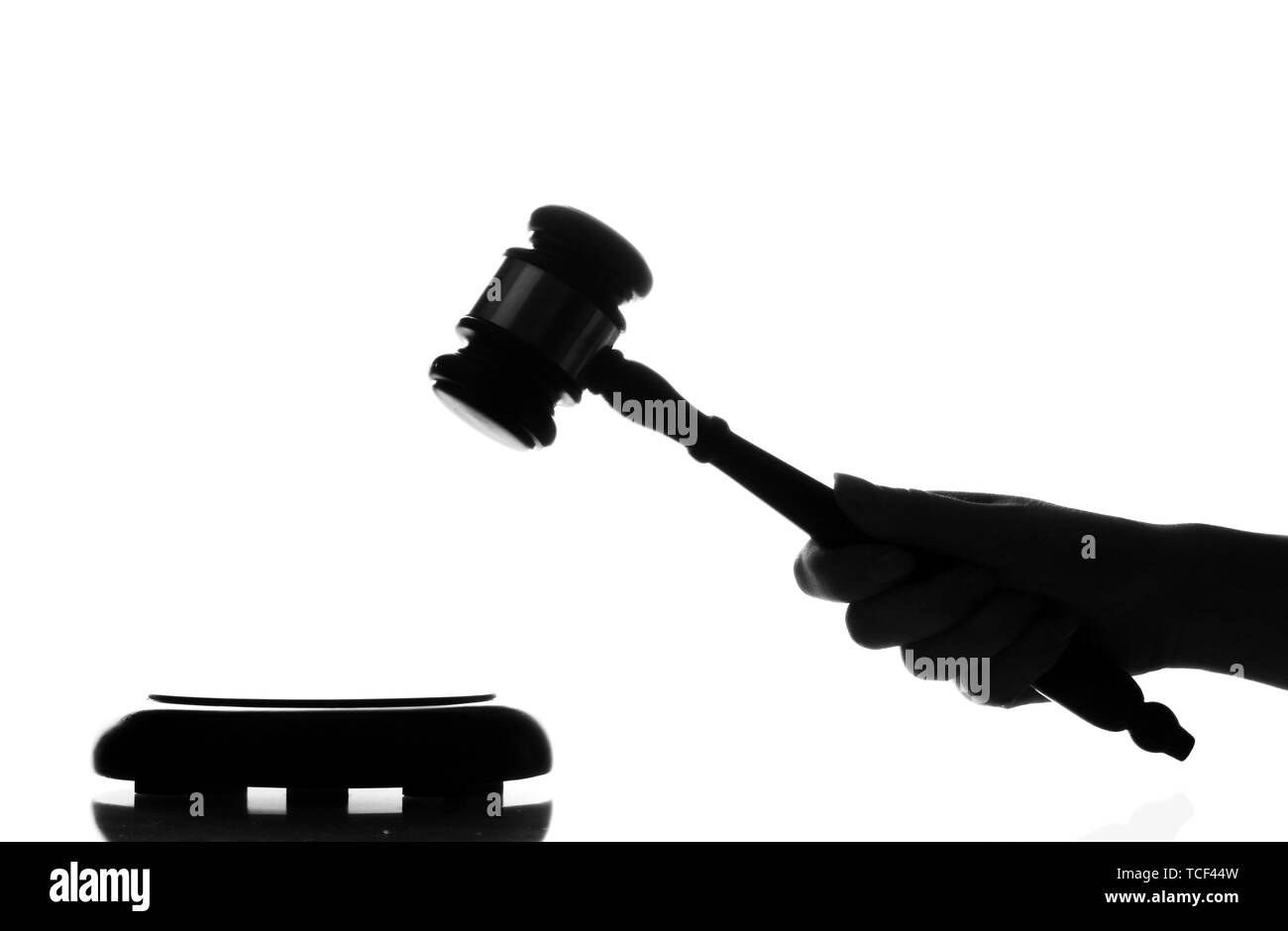 Judge gavel in hand symbol Cut Out Stock Images & Pictures - Alamy