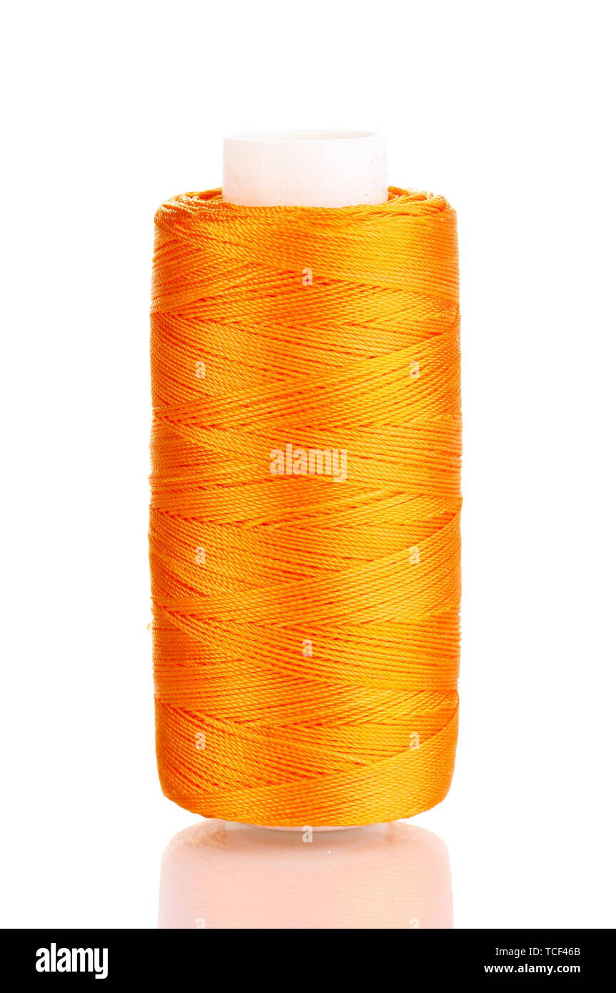 Orange bobbin thread isolated on white Stock Photo - Alamy