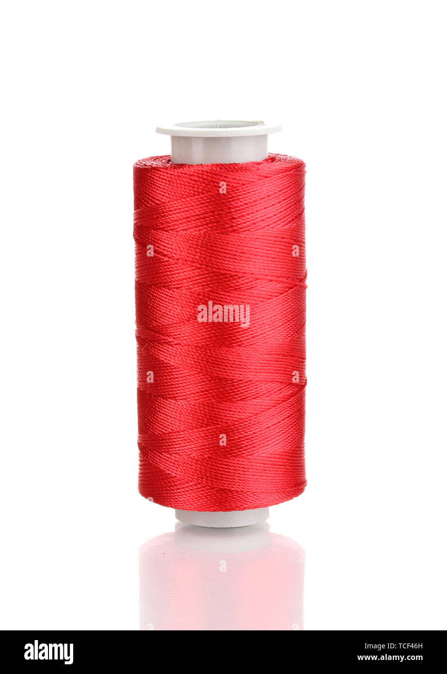 Red bobbin thread isolated on white Stock Photo - Alamy