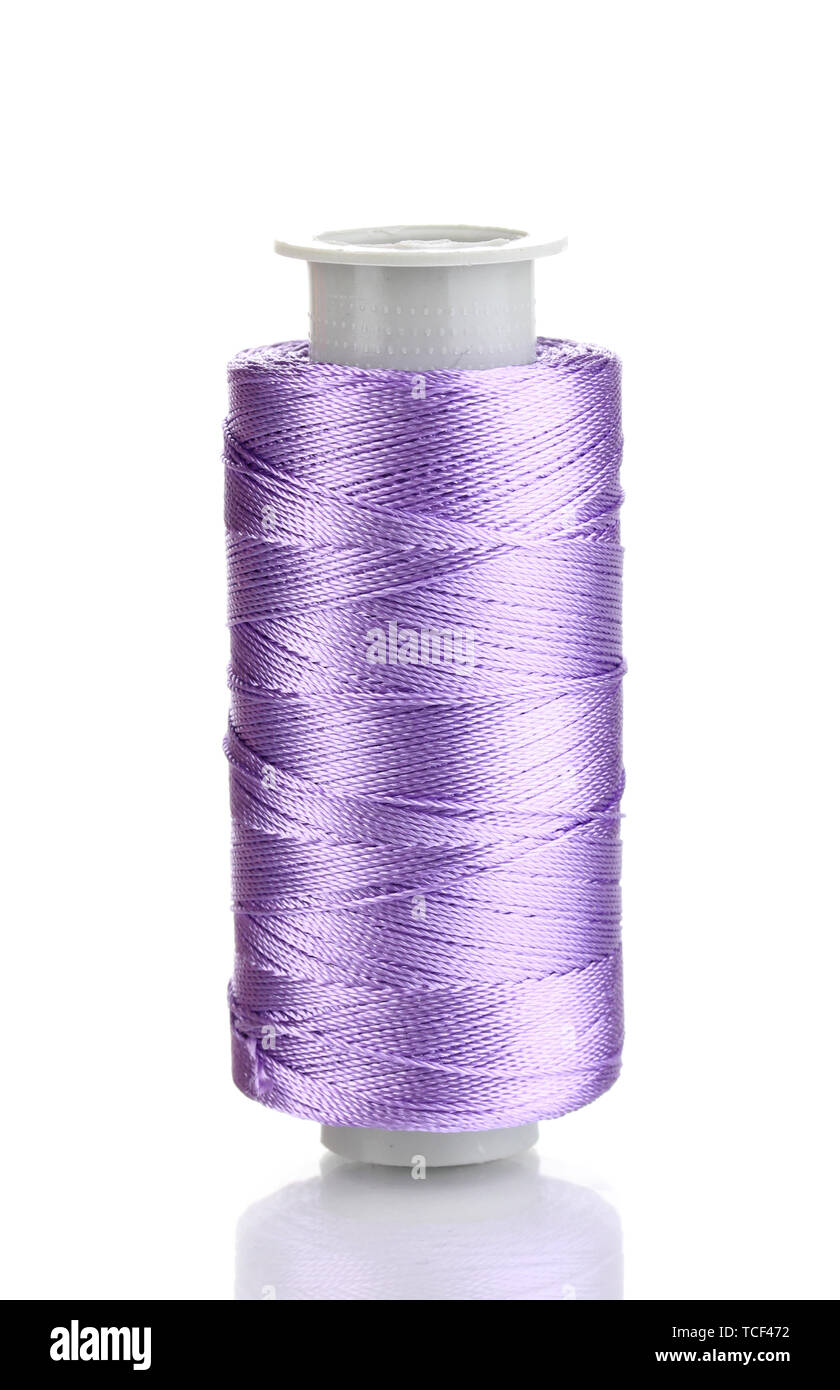 Violet bobbin thread isolated on white Stock Photo - Alamy
