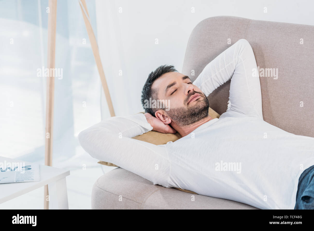 handsome bearded man with eyes closed and Hands Behind Back sleeping on ...