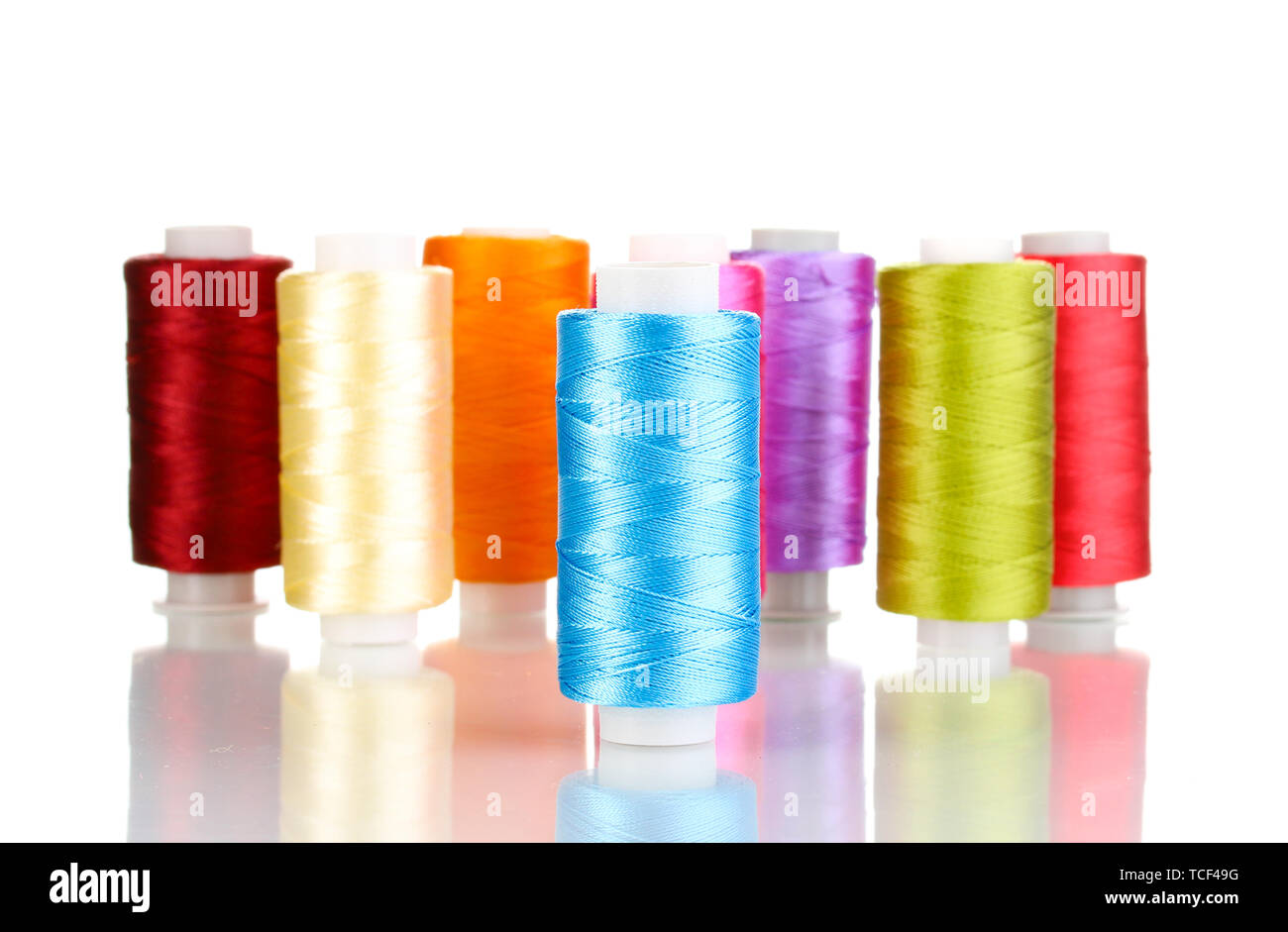 Many spools of thread isolated on white Stock Photo - Alamy