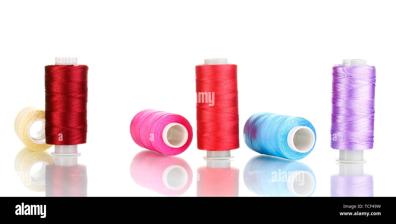 Many spools of thread isolated on white Stock Photo - Alamy