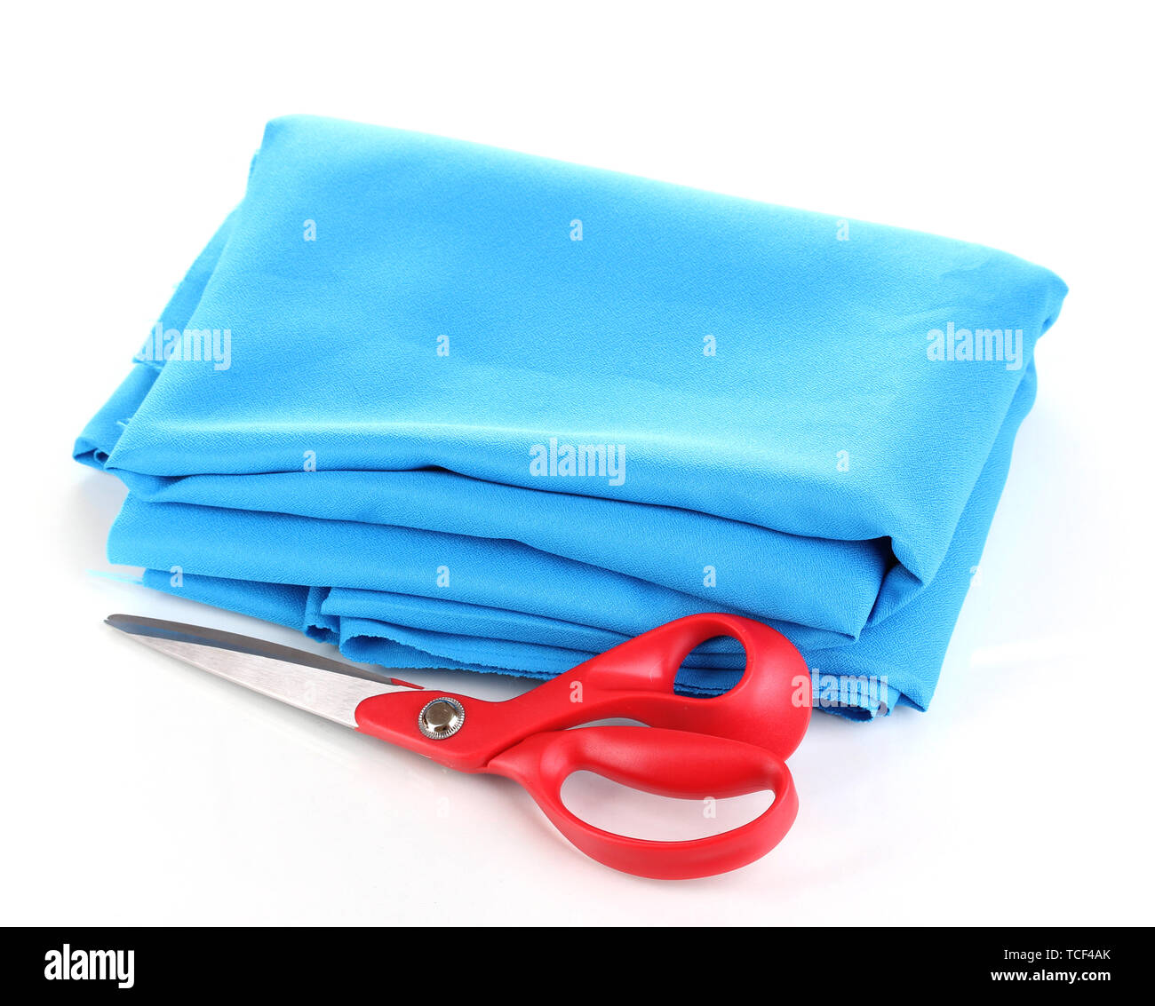 Scissors on fabric isolated on white Stock Photo - Alamy