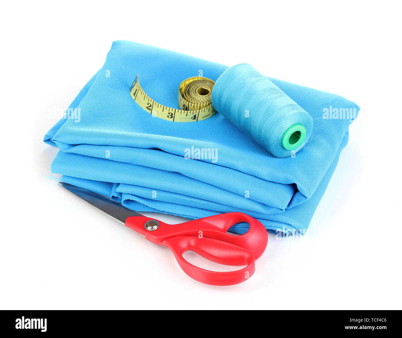 Scissors, bright thread, measuring tape and fabric isolated on white ...