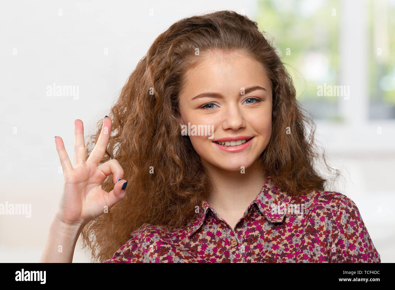 Happy smiling business woman with ok hand sign Stock Photo - Alamy