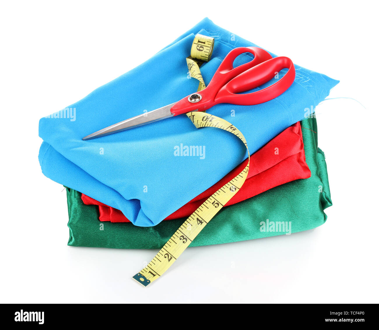 Scissors and measuring tape on fabric isolated on white Stock Photo - Alamy