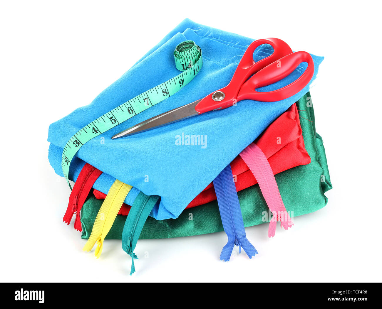 Scissors and measuring tape on fabric isolated on white Stock Photo - Alamy