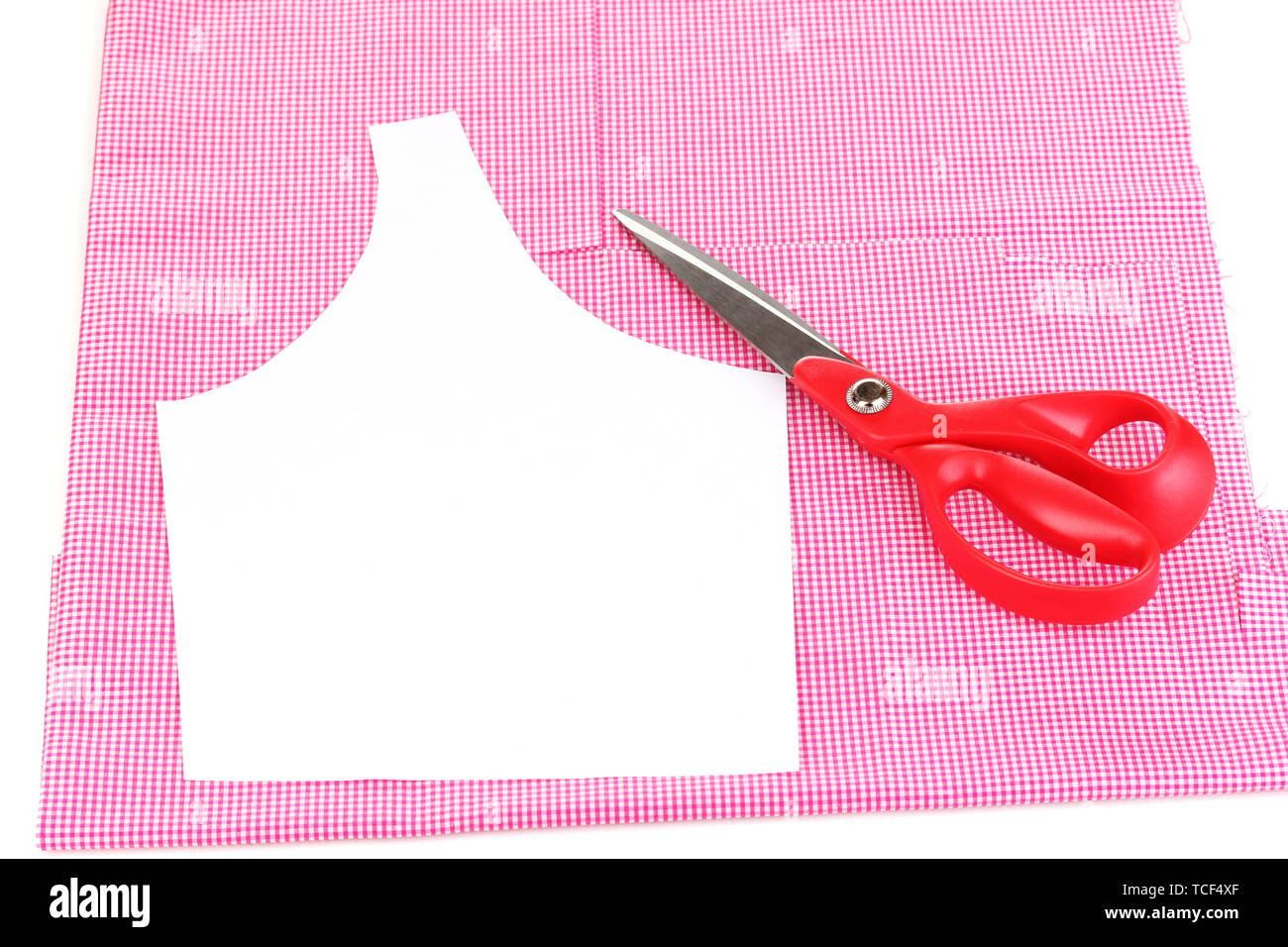 Scissors and pattern on fabric isolated on white Stock Photo - Alamy