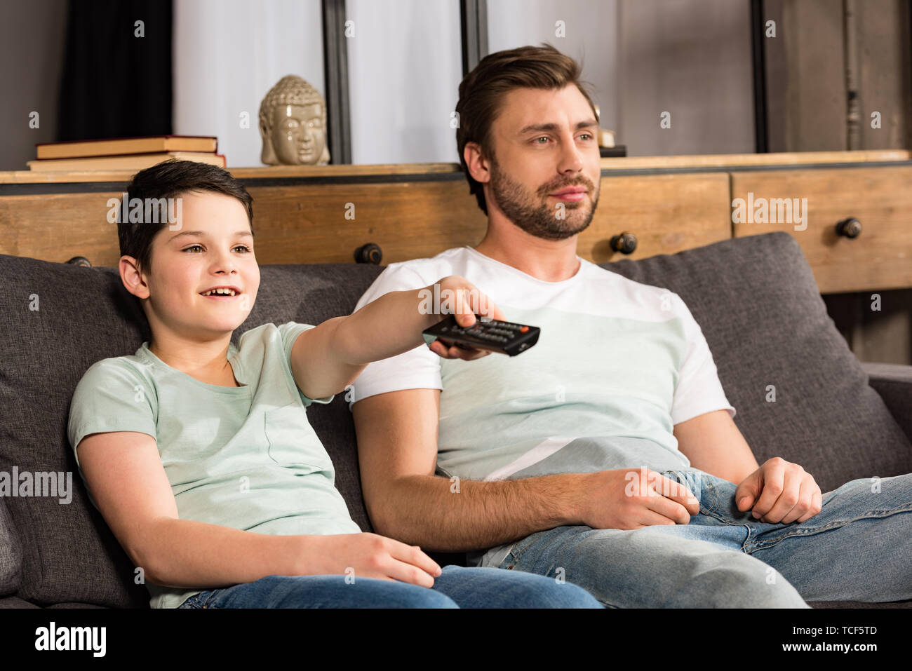 Son father remote controller hi-res stock photography and images - Alamy